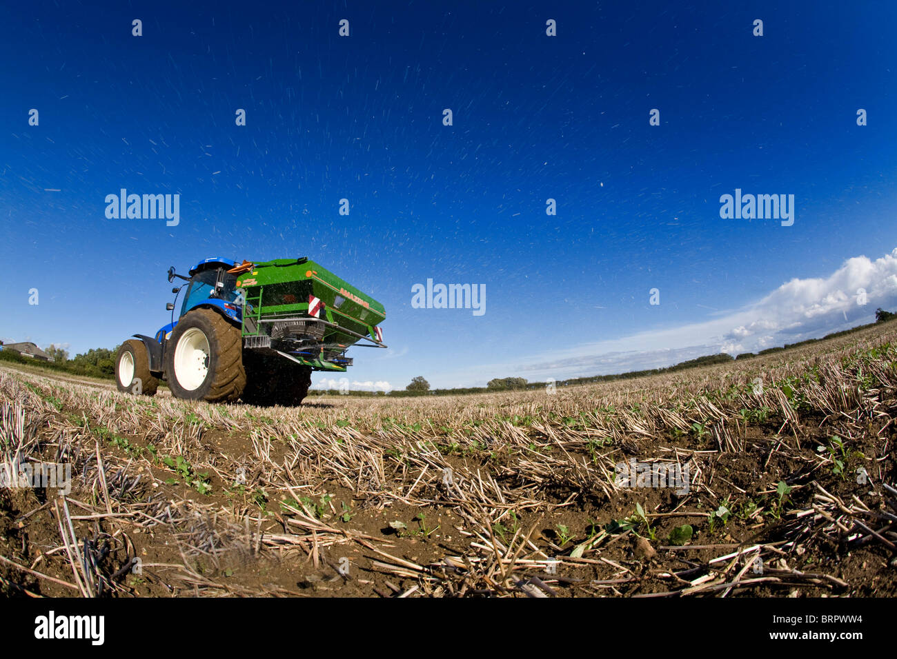 A Tractor spreading Nitrogen Stock Photo - Alamy