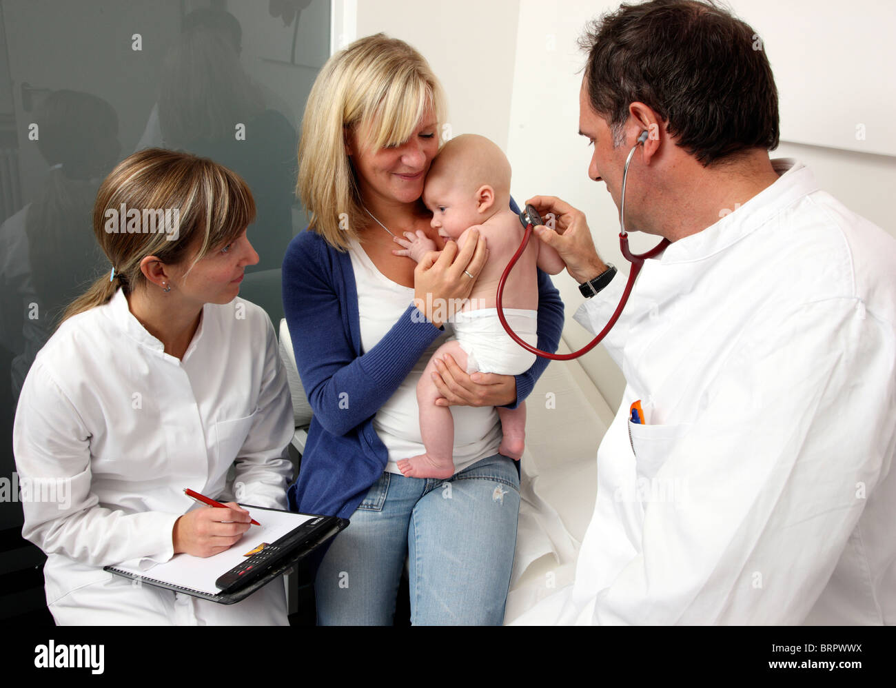 Doctor's surgery, paediatrician. Mother and baby. Medical examination ...