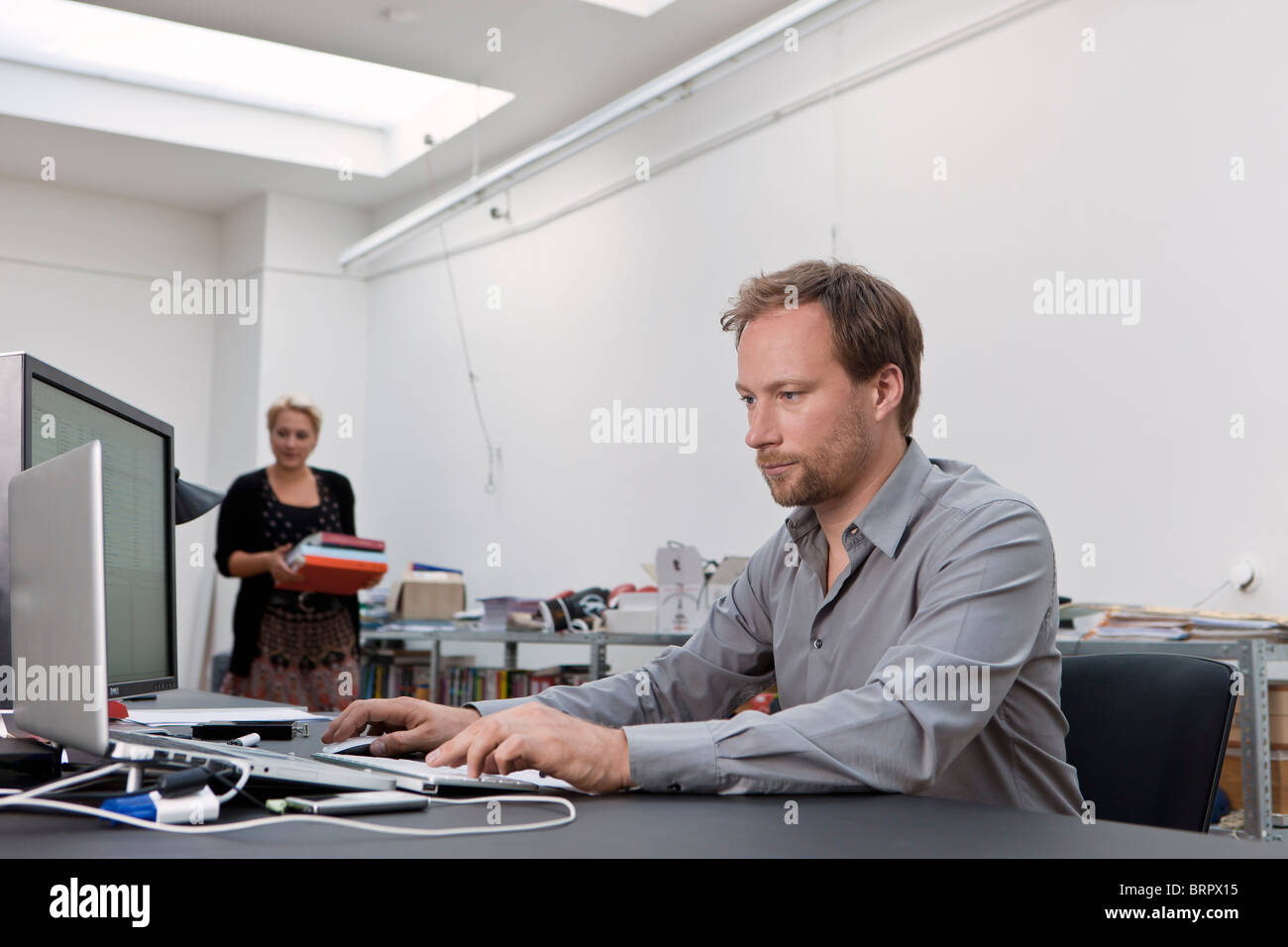 Designer working at his desk Stock Photo - Alamy