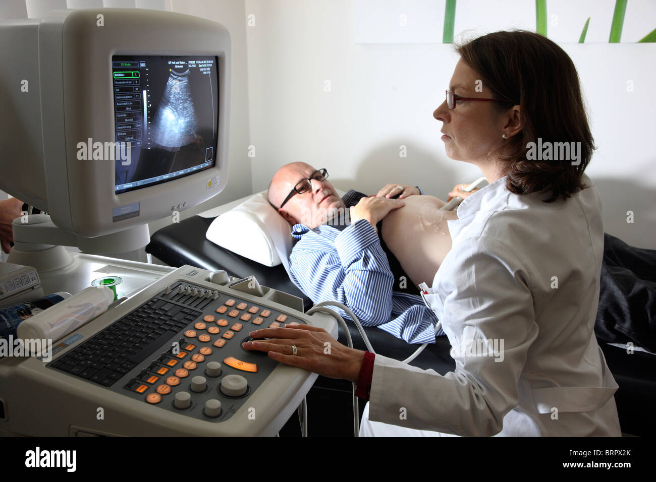 Ultrasound scanning of a male patient, medical practice in a doctors ...