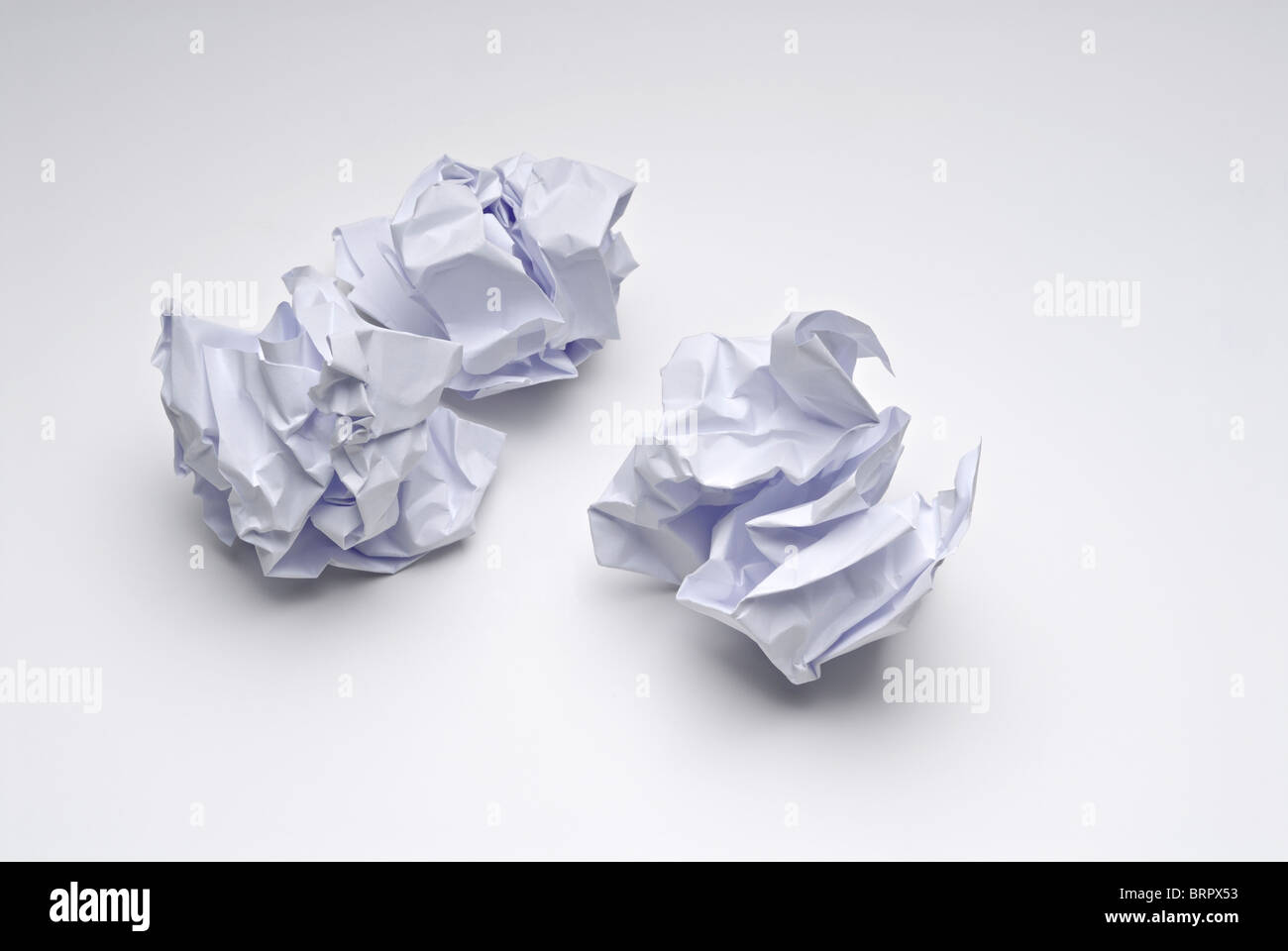 Three Crumpled white paper balls Stock Photo - Alamy
