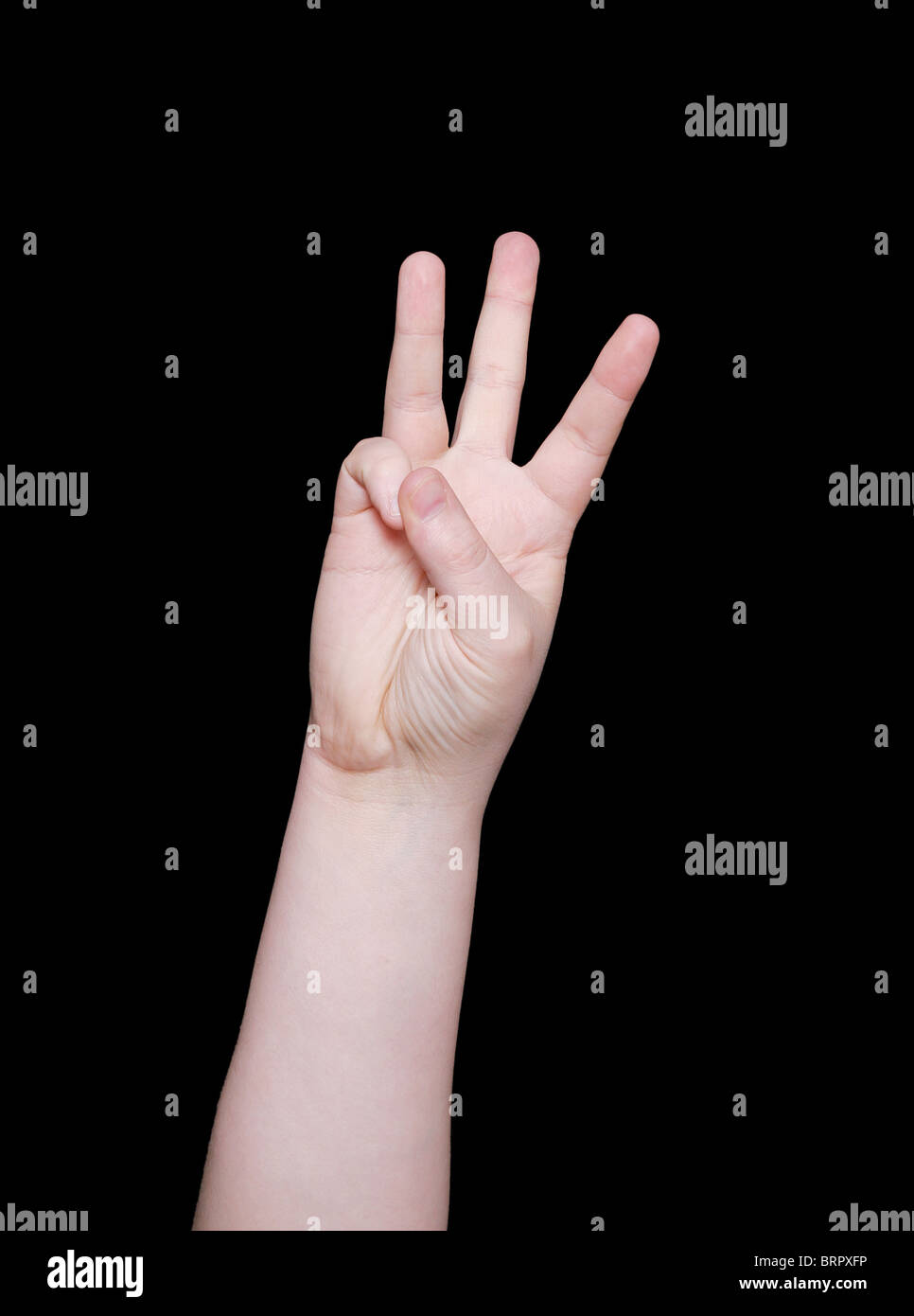 the letter w in sign language on a black background Stock Photo - Alamy