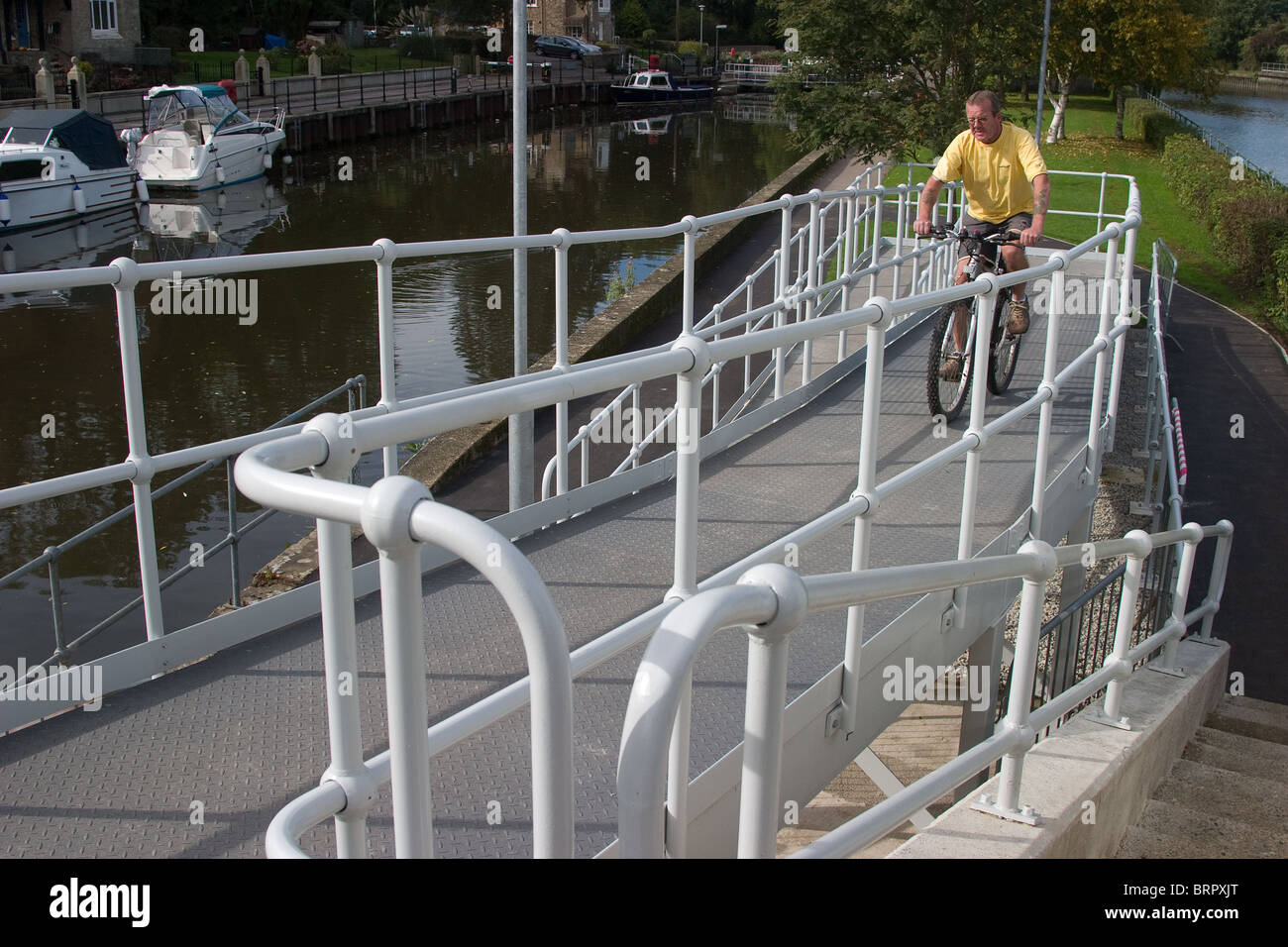 disabled cyclist access river crossing fence rail Stock Photo - Alamy