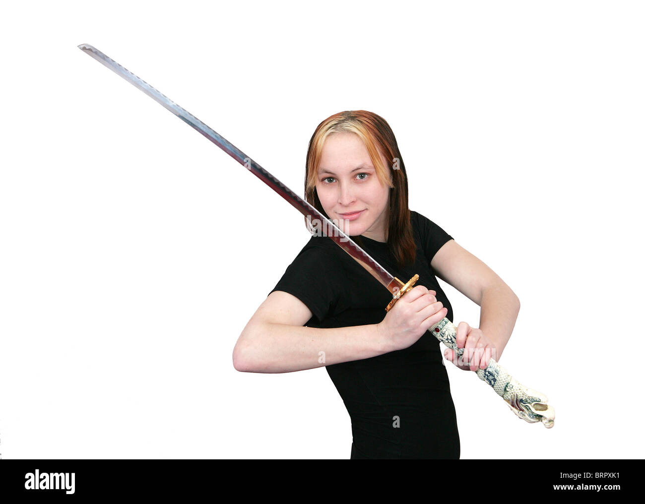 attractive beautiful young woman mma student with a sword drawn ready ...