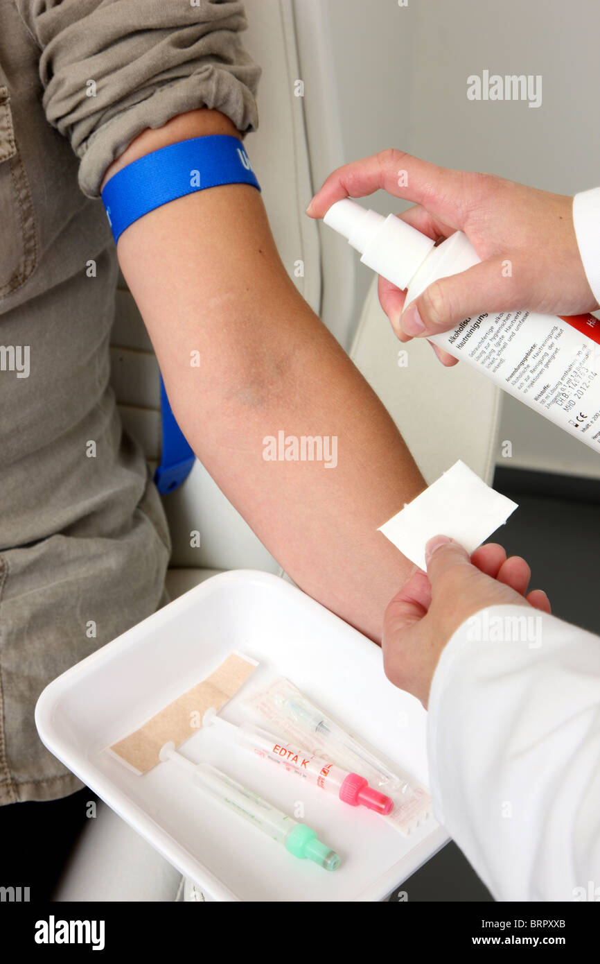 Medical practice. Doctors assistant taking a blood sample of a patient ...