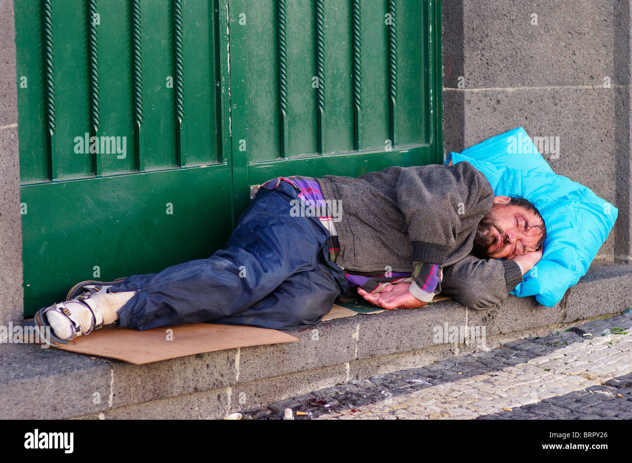 Homeless man sleeping on doorstep hi-res stock photography and images ...