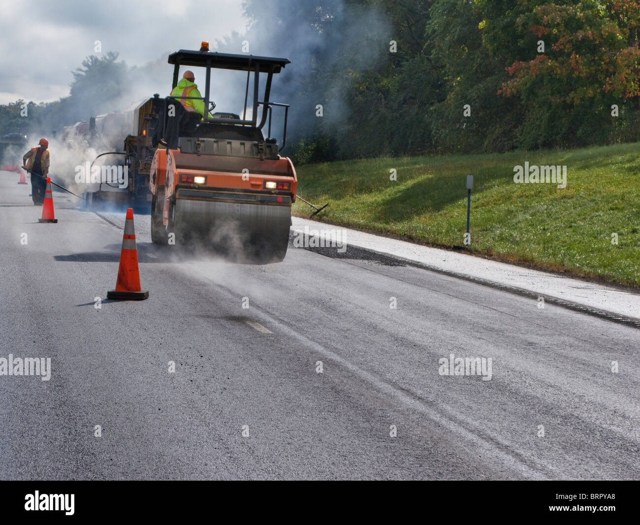 men at work with asphalt paving equipment Stock Photo - Alamy