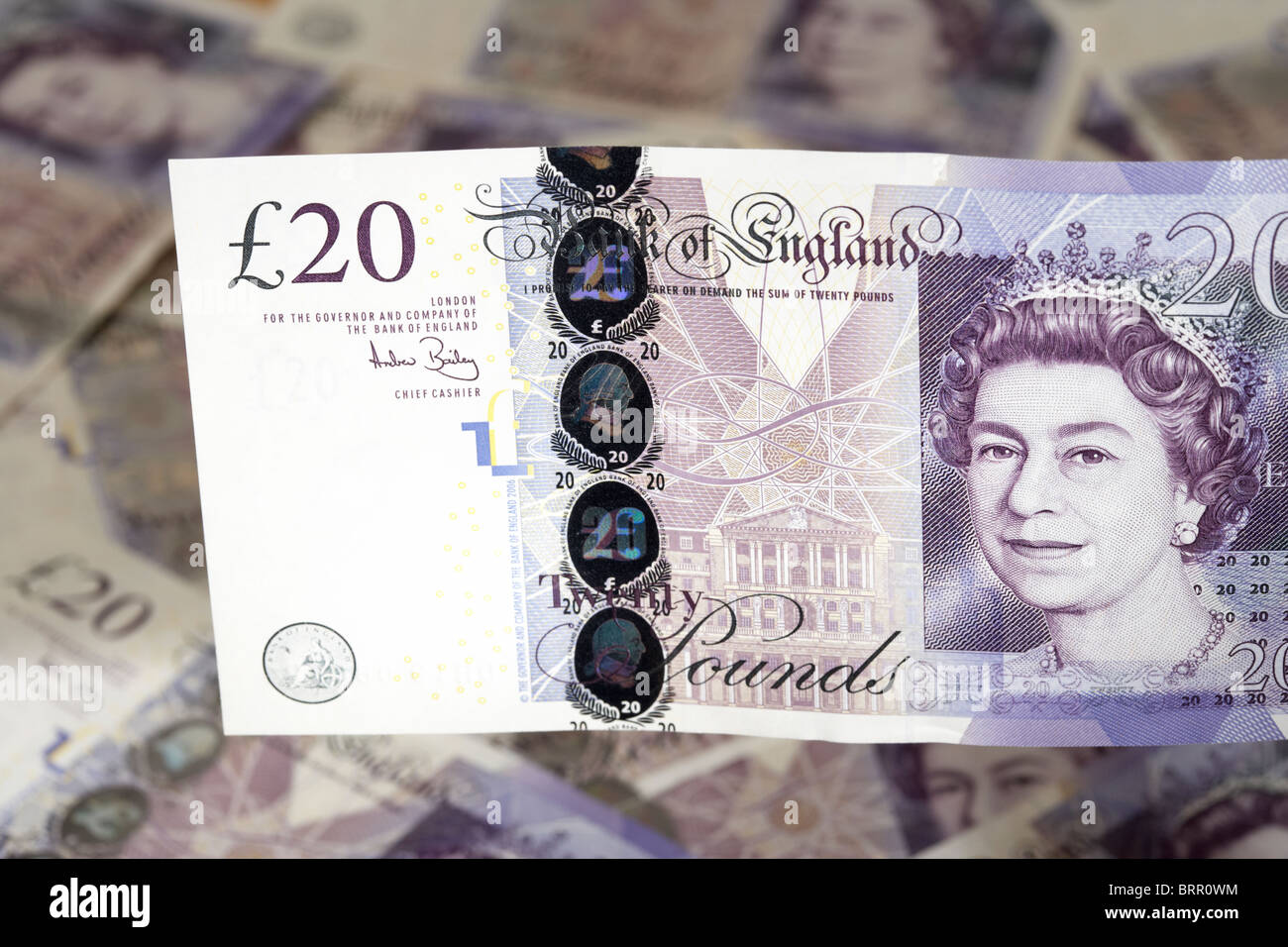 pile of twenty pounds sterling banknotes with twenty pound note Stock ...