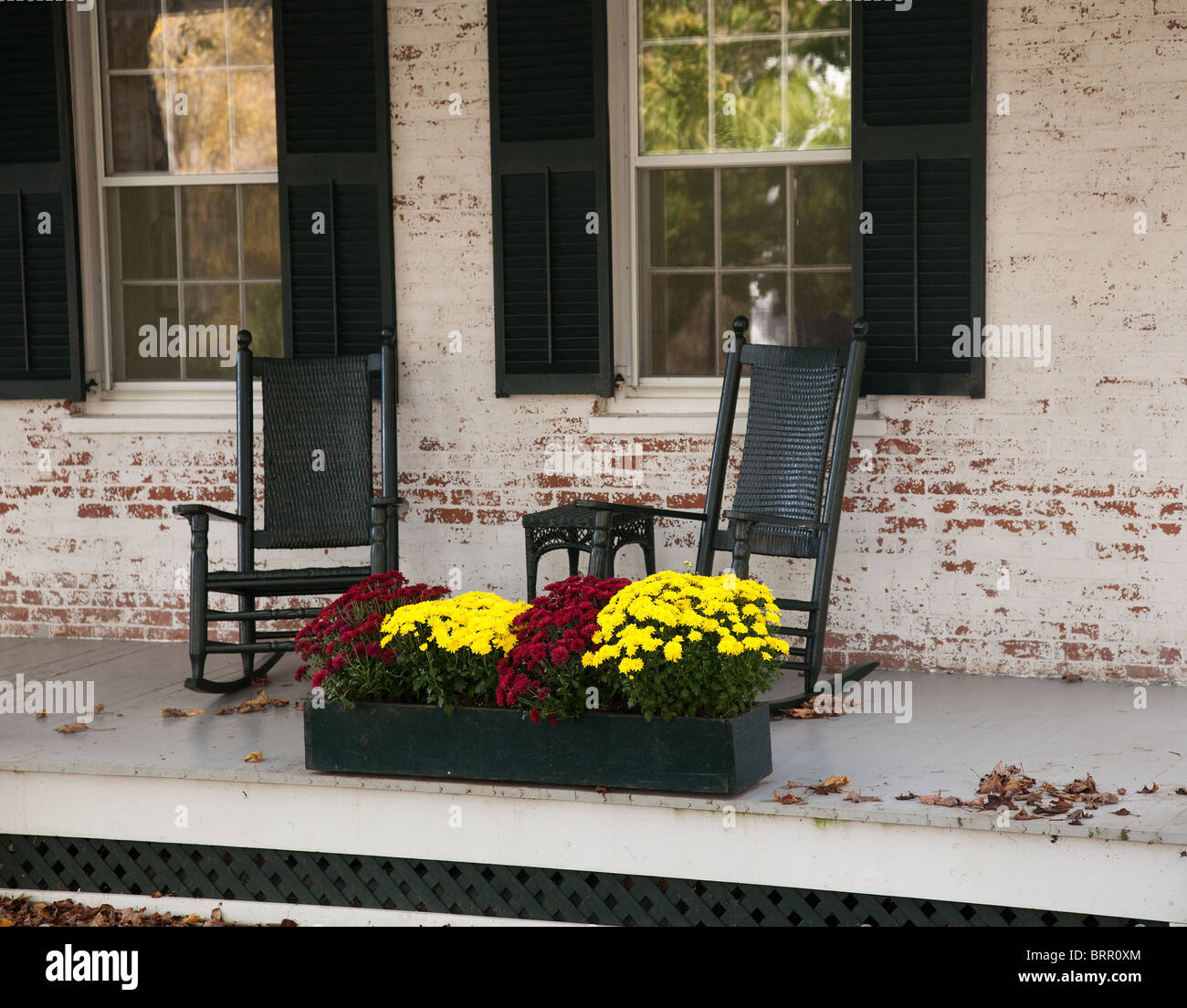 Pair of old rocking chairs on porch of old building in fall Stock Photo ...