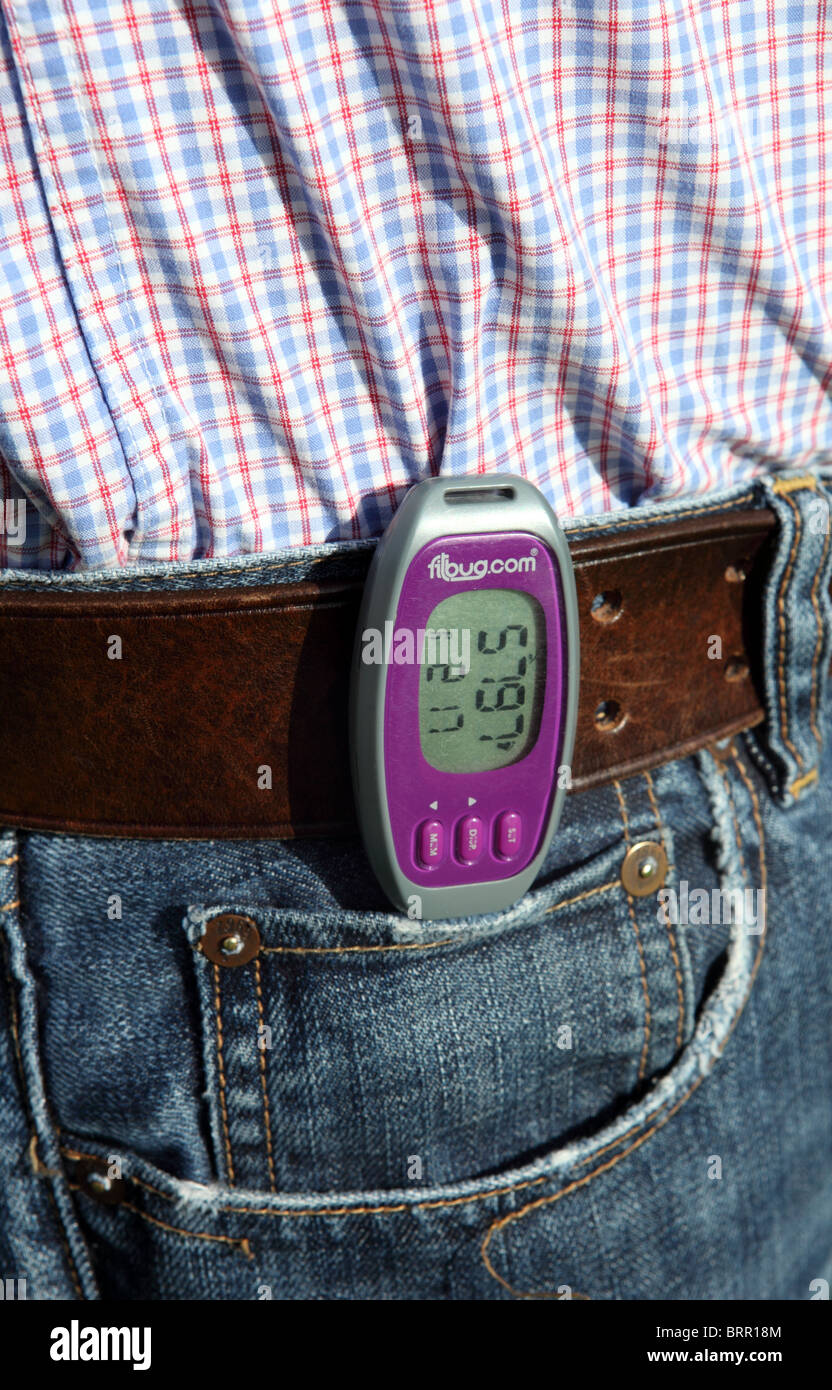 Pedometer on the leather belt of a man wearing jeans and shirt Stock ...