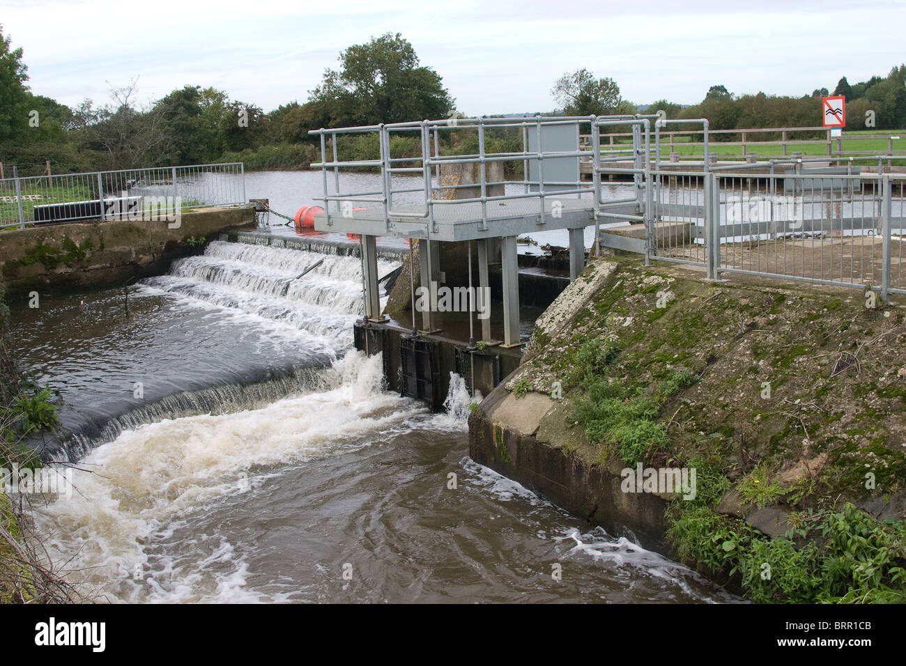 fast flowing weir river water flood control levels Stock Photo - Alamy