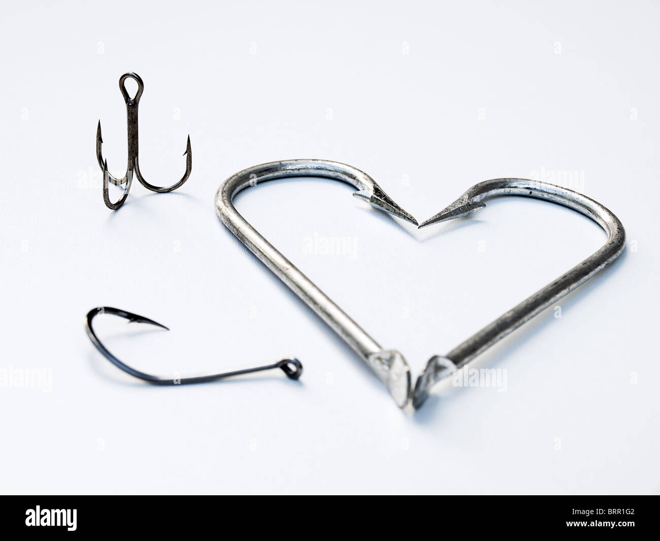 Hooks in a conceptual shape on a bright background Stock Photo - Alamy