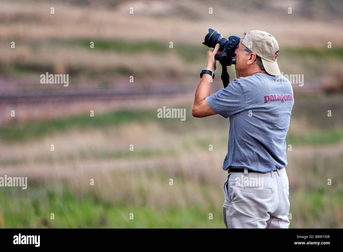 Professional photographer Jim Reed takes a photo, May 29, 2010 Stock ...