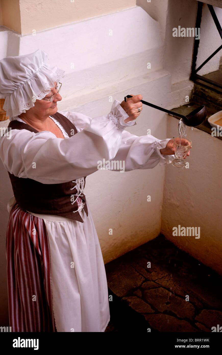 Costumed dipper serves spa water from the Chalybeate Spring at ...