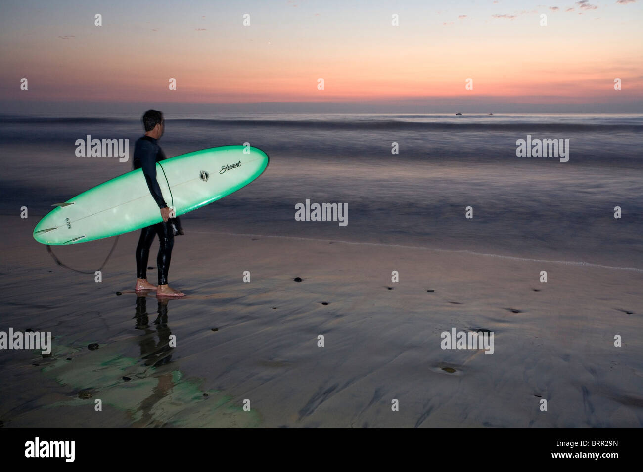 Surfer watching sunset at beach, Del Mar, California Stock Photo - Alamy Surfer watching sunset at beach, Del Mar, California Stock Photo - Alamy
