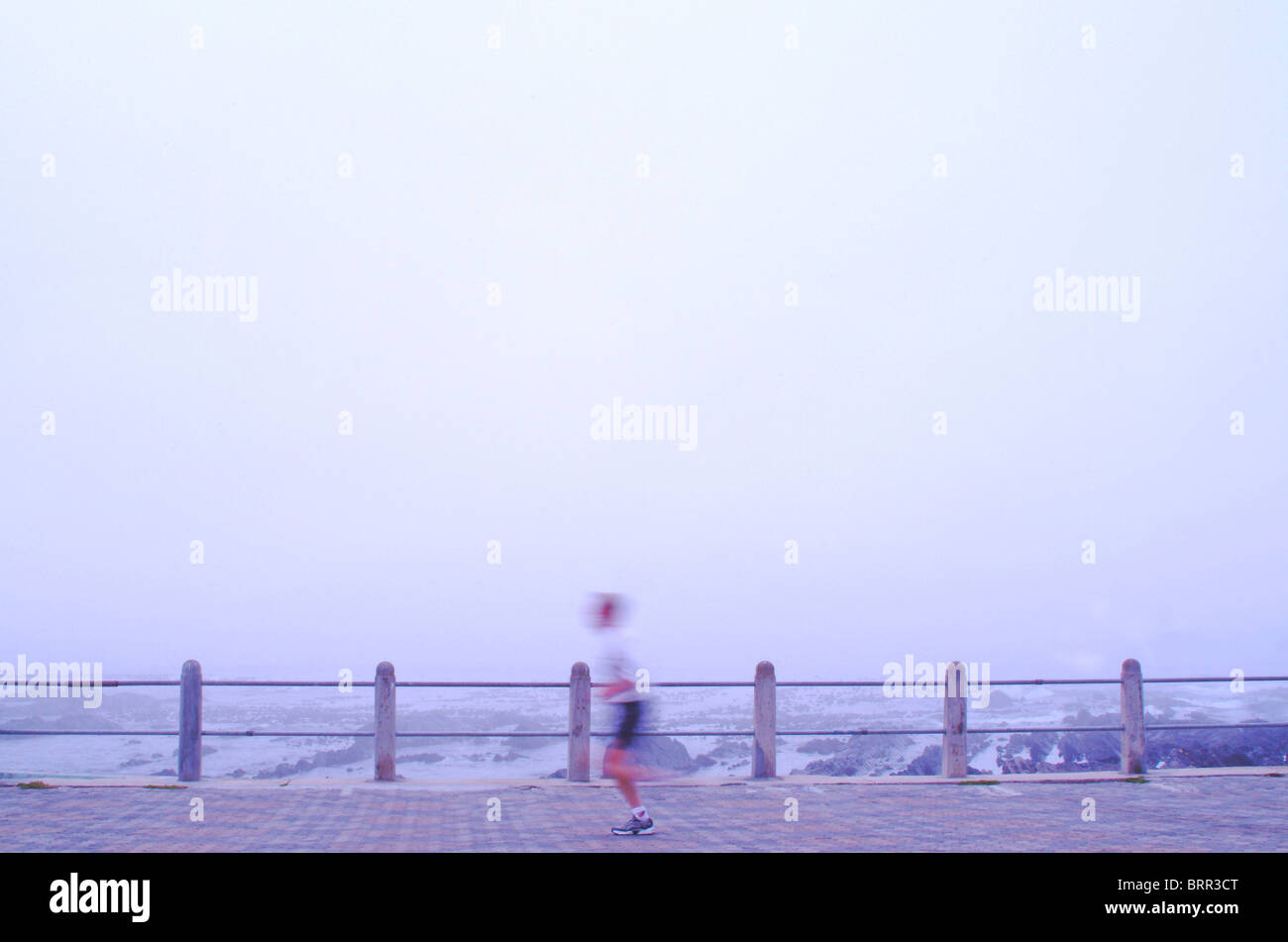 Waterfront with jogger running Stock Photo - Alamy