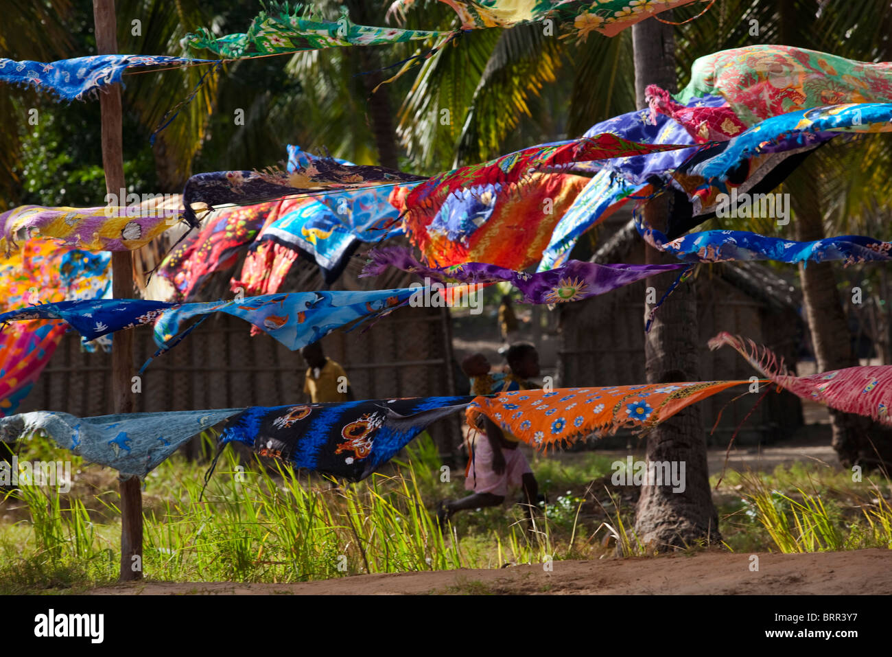 Colourful printed cloths for sale at a roadside stall Stock Photo - Alamy