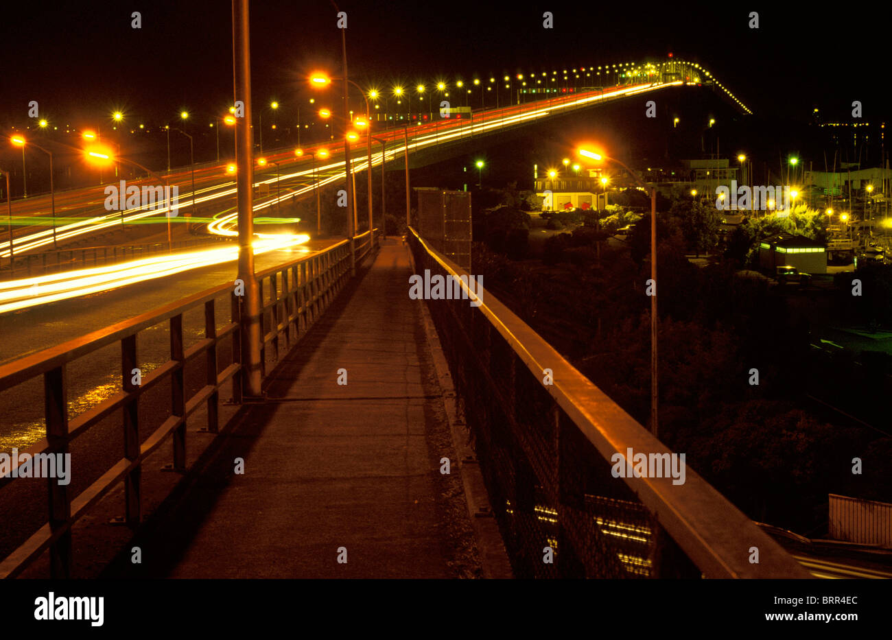 Light trails over harbour bridge at night Stock Photo - Alamy