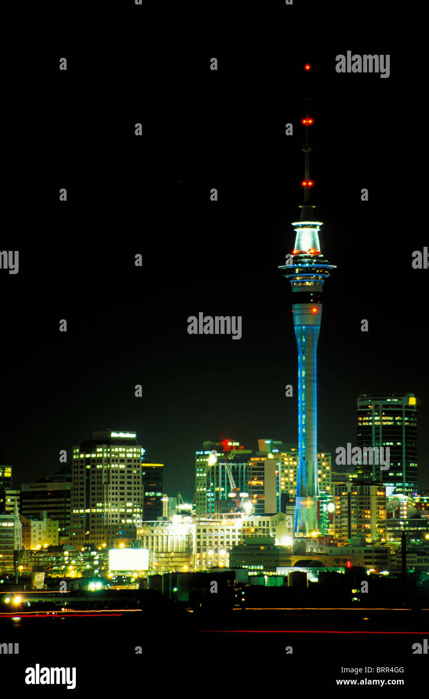 Auckland city skyline at night with illuminated Sky tower Stock Photo ...