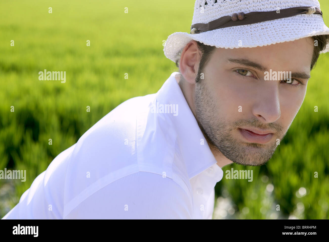Mediterranean man portrait white hat in green meadow rice field Stock ...
