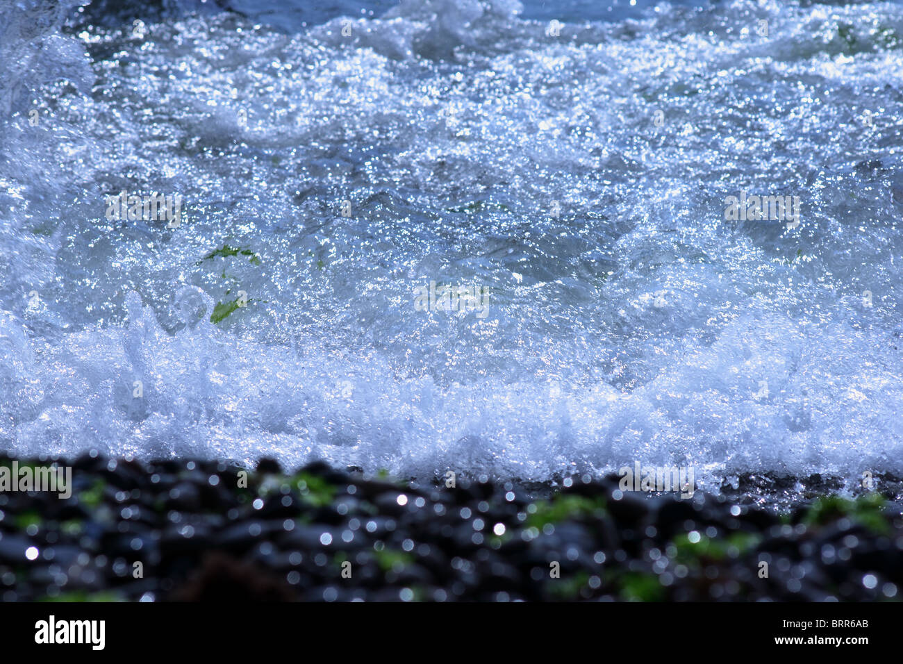 pebble and wawe Stock Photo - Alamy