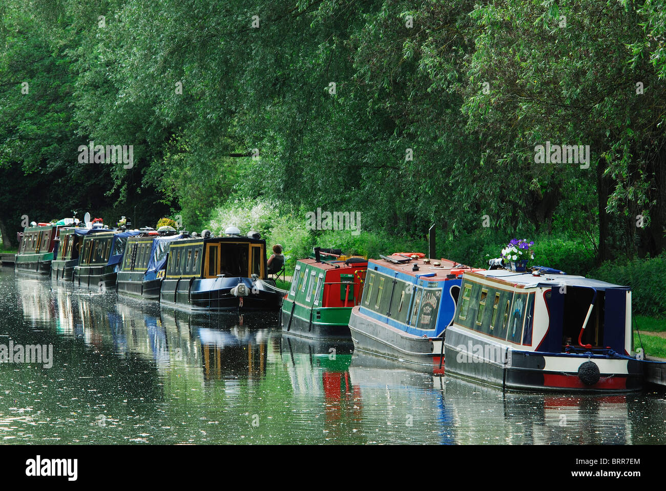 A peaceful scene of narrow boats moored on the Kennet and Avon canal ...