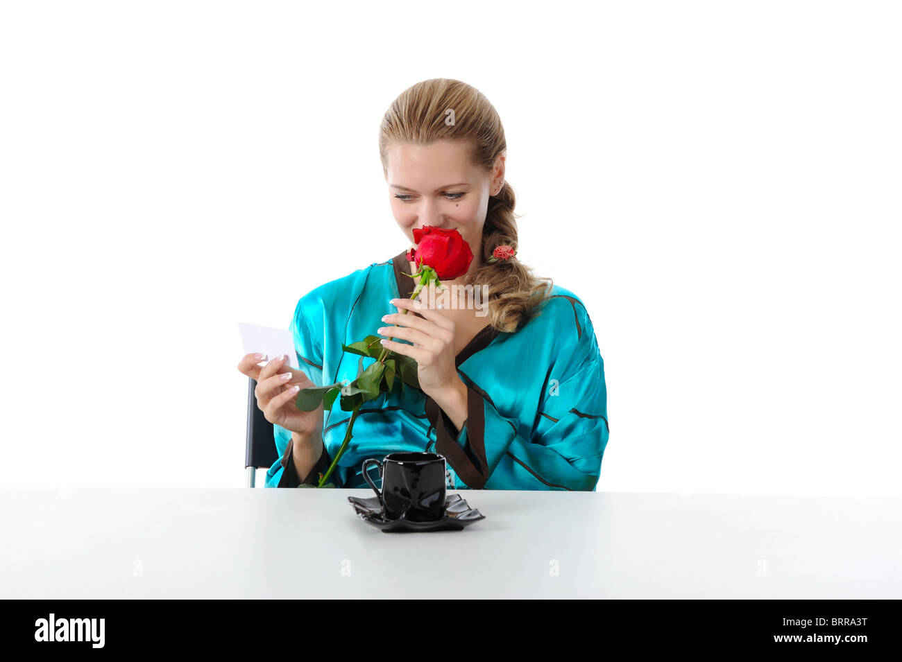 Beautiful girl reading a love note Stock Photo - Alamy