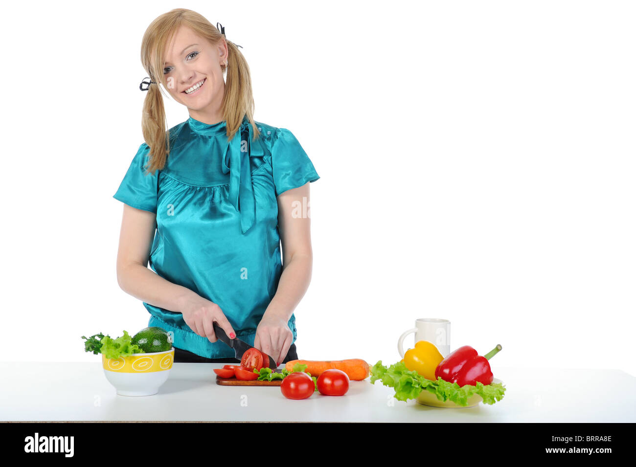 Beautiful smiling girl in the kitchen Stock Photo - Alamy