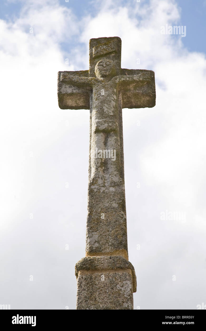 Smiling stone Jesus on the cross in the French village Montrol Senard ...