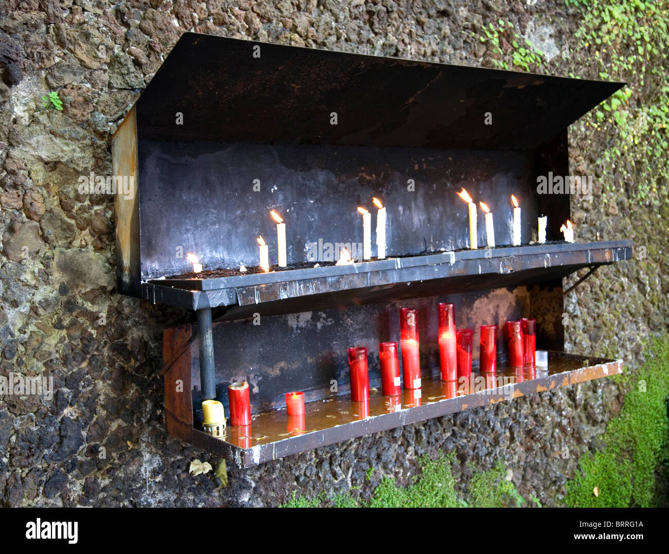 Lighting devotion candles at Largo Da Fonte - Monte - Madeira Stock ...