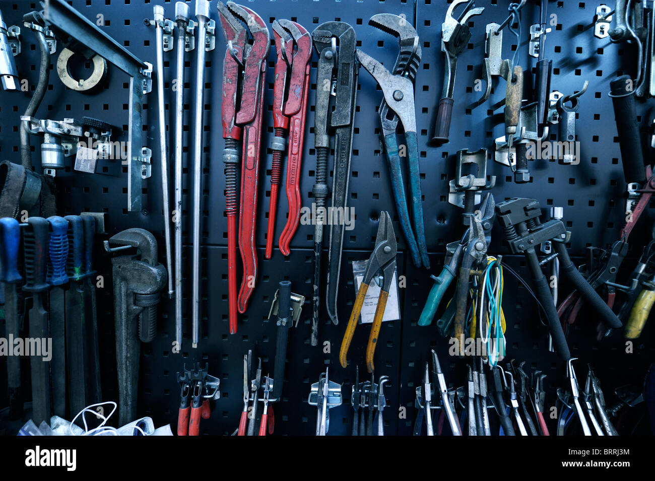Car workshop with mechanic at work Stock Photo - Alamy