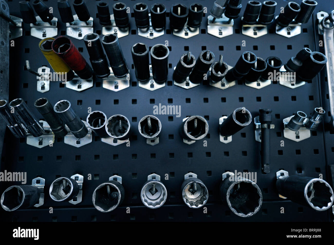 Car workshop with mechanic at work Stock Photo - Alamy