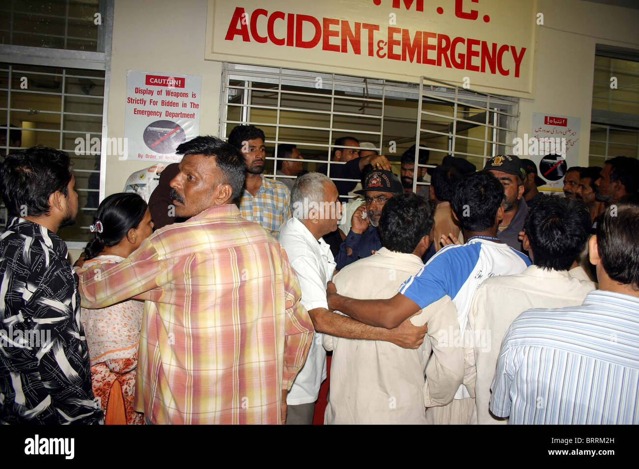 People gather at Jinnah hospital after two bomb explosions in Karachi ...