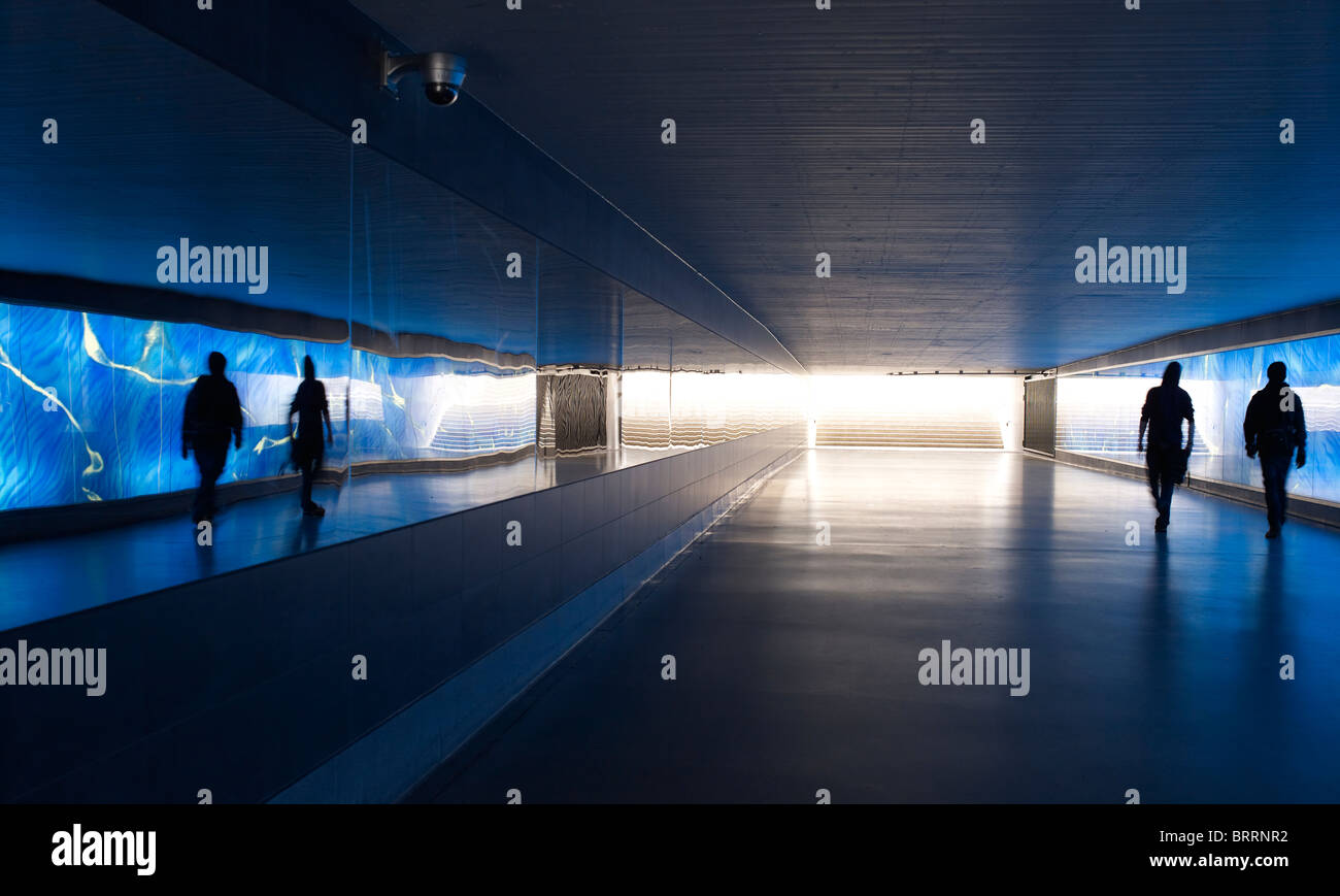 pedestrians passing a subway in modern design with video.observation ...
