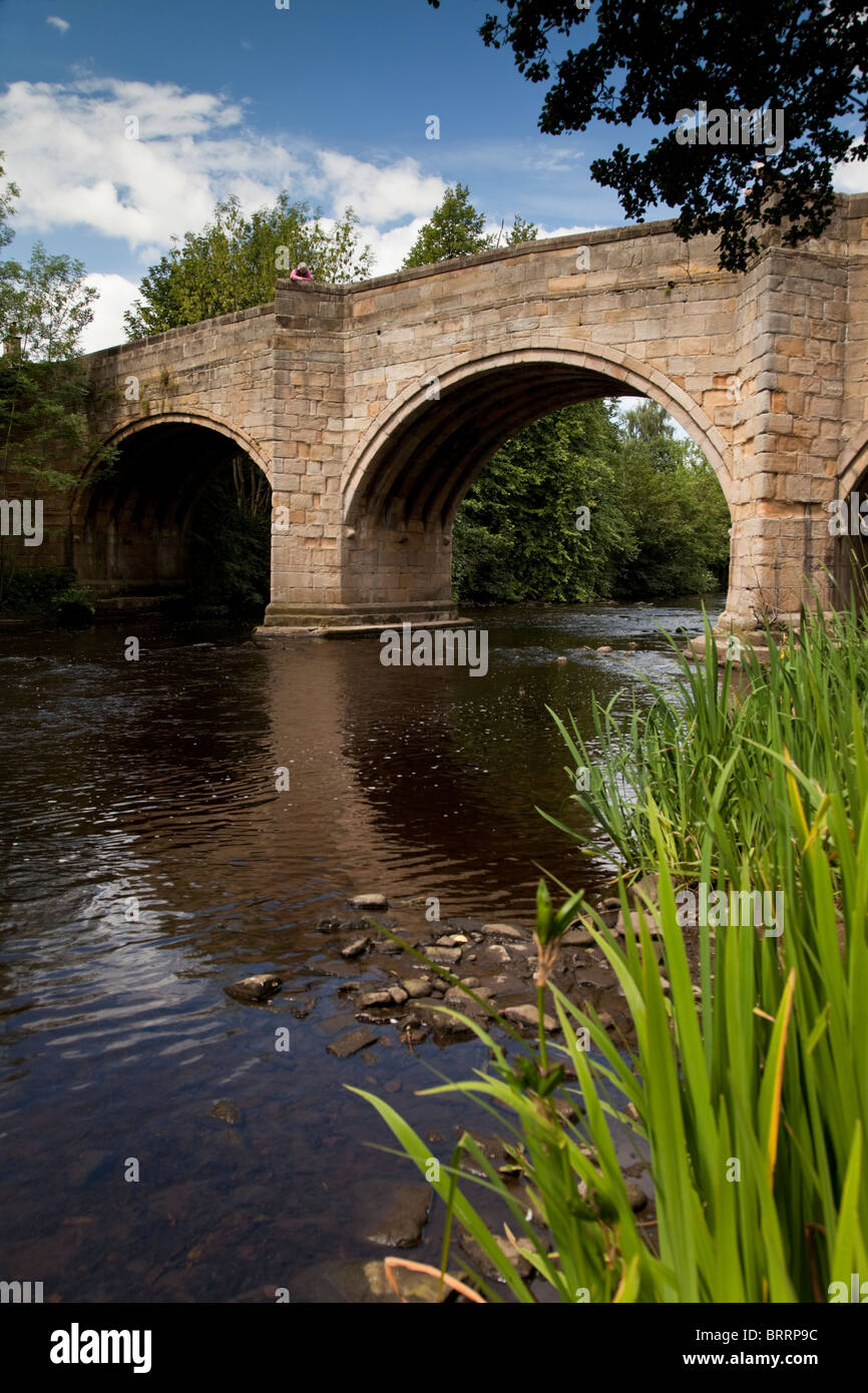 Baslow bridge in the village of Baslow in the Peak District Derbyshire ...