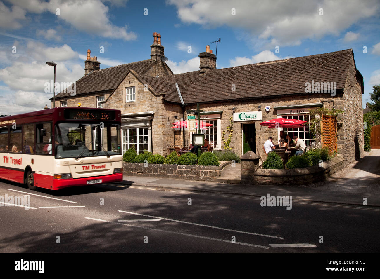 main road through the Village of Baslow in the Peak District Derbyshire ...