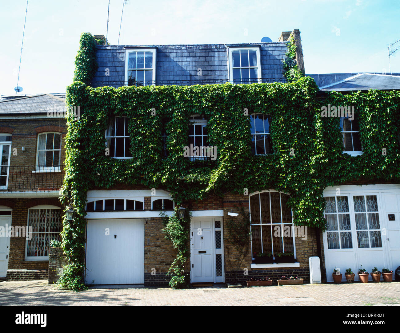 White doors on integral garage of traditional terraced townhouse ...