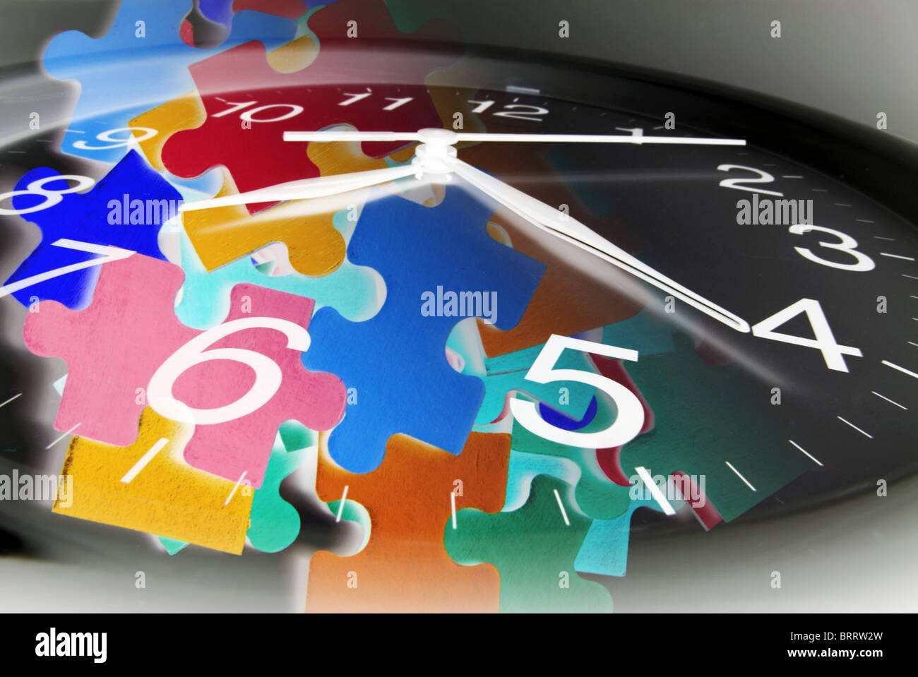 Clock and Jigsaw Puzzle Pieces Stock Photo - Alamy
