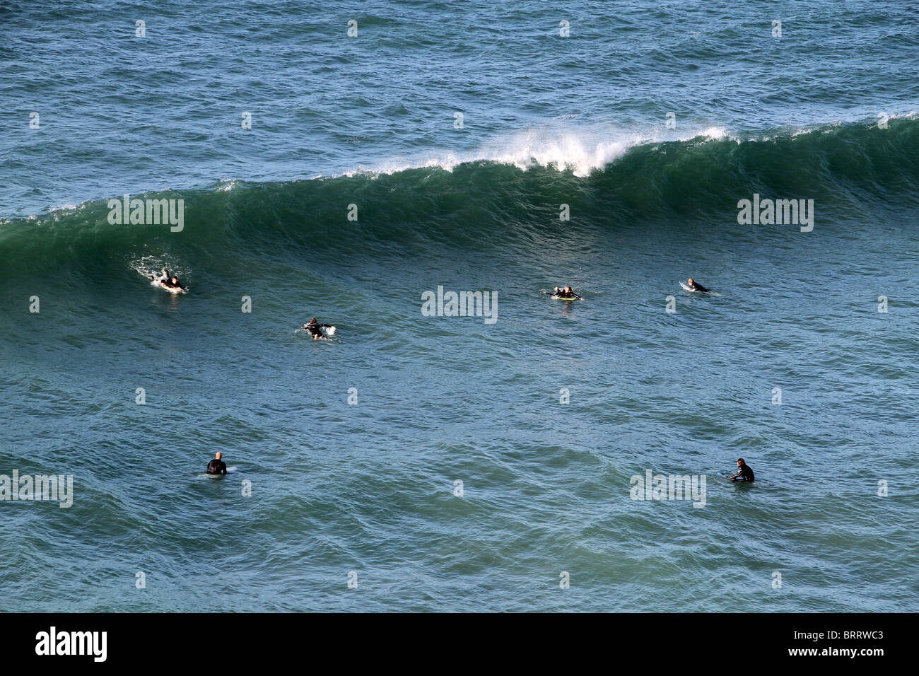 Surfing off the Cornish coast Stock Photo - Alamy