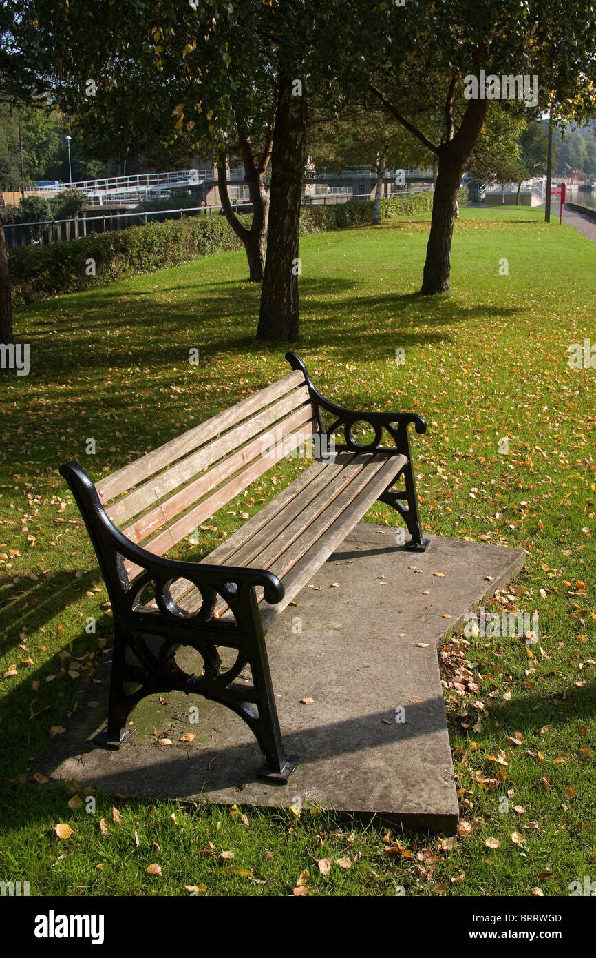 autumn lawn grass wooden bench seating sunny day Stock Photo - Alamy