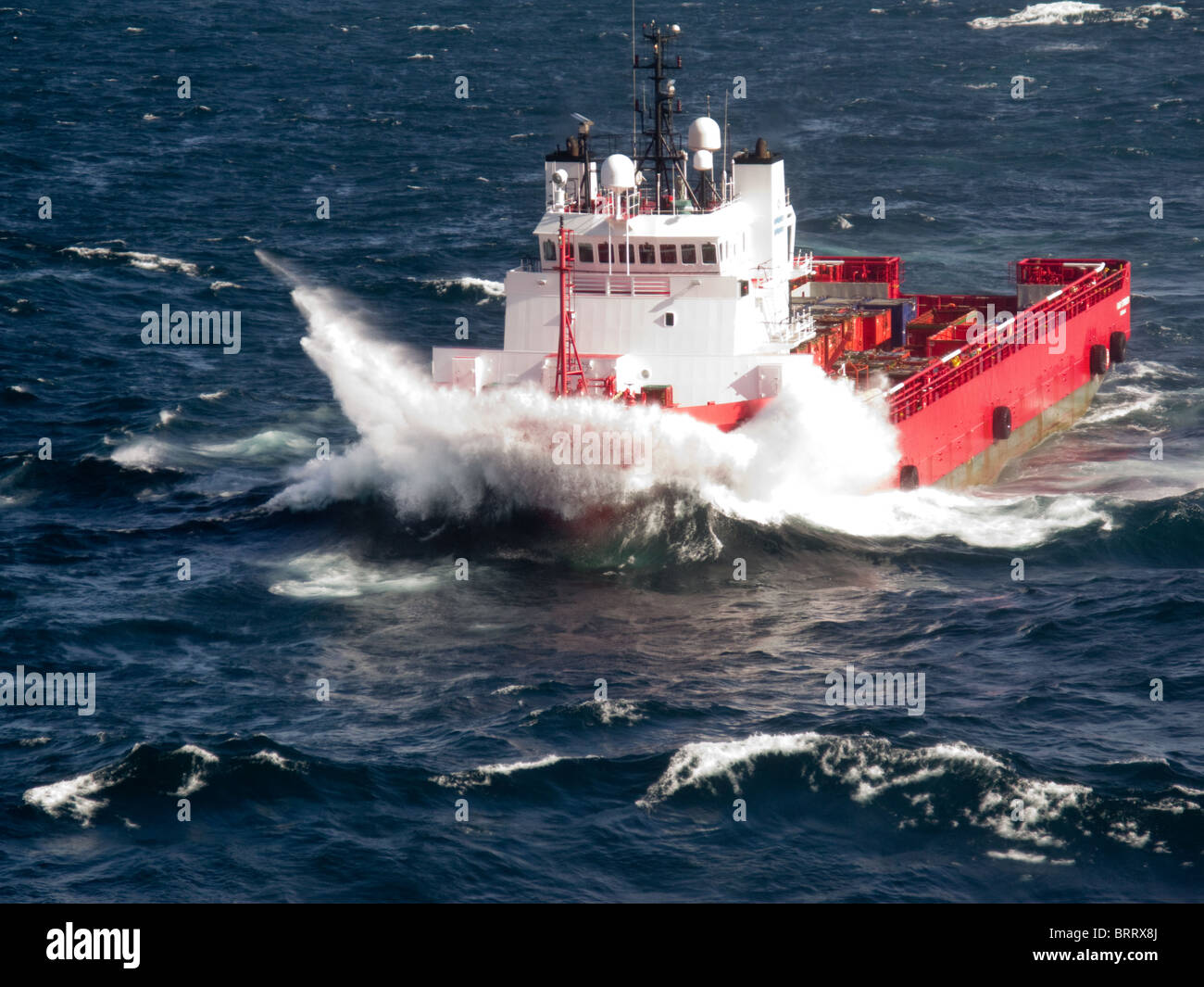 An oil rig supply ship battling through high seas in the British North ...