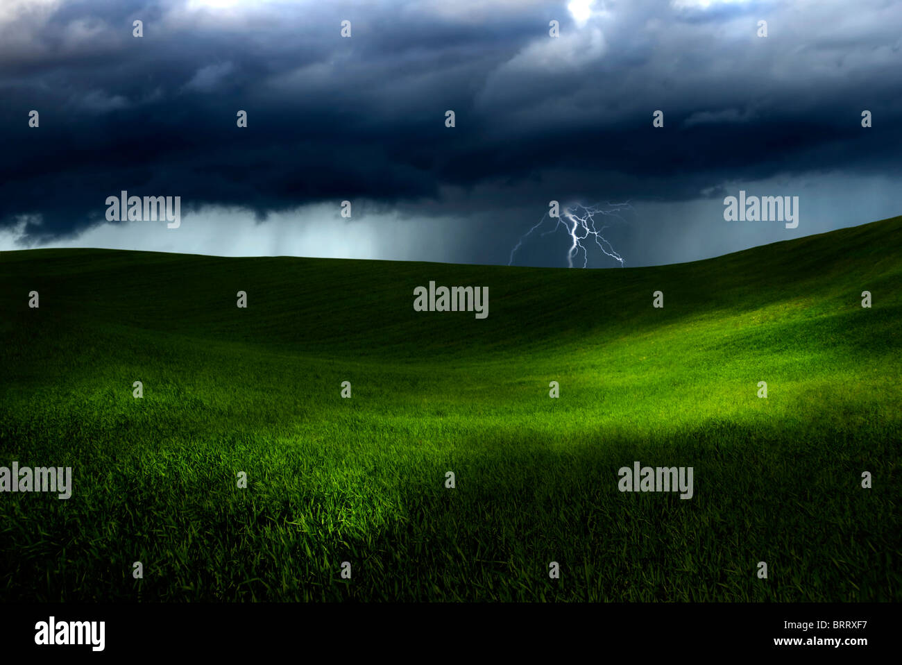 Beautiful green meadow with storm clouds and thunders Stock Photo - Alamy