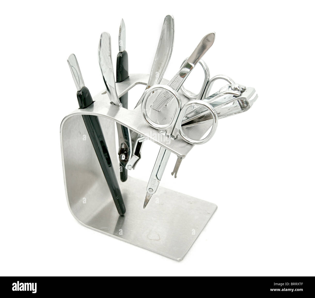 a silver personal hygiene kit for a bathroom with scissors, trimmers ...