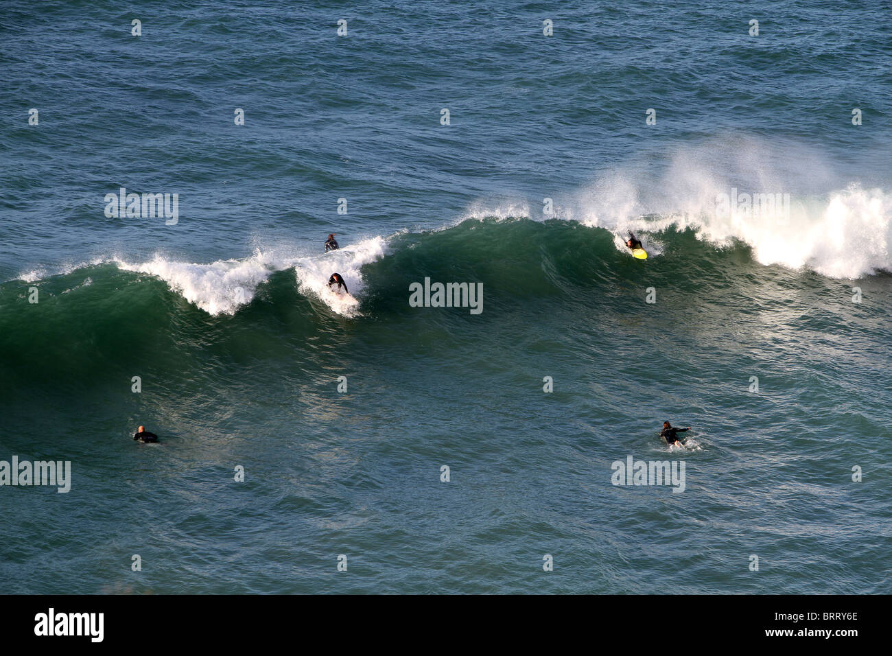 Surfing off the Cornish coast Stock Photo - Alamy
