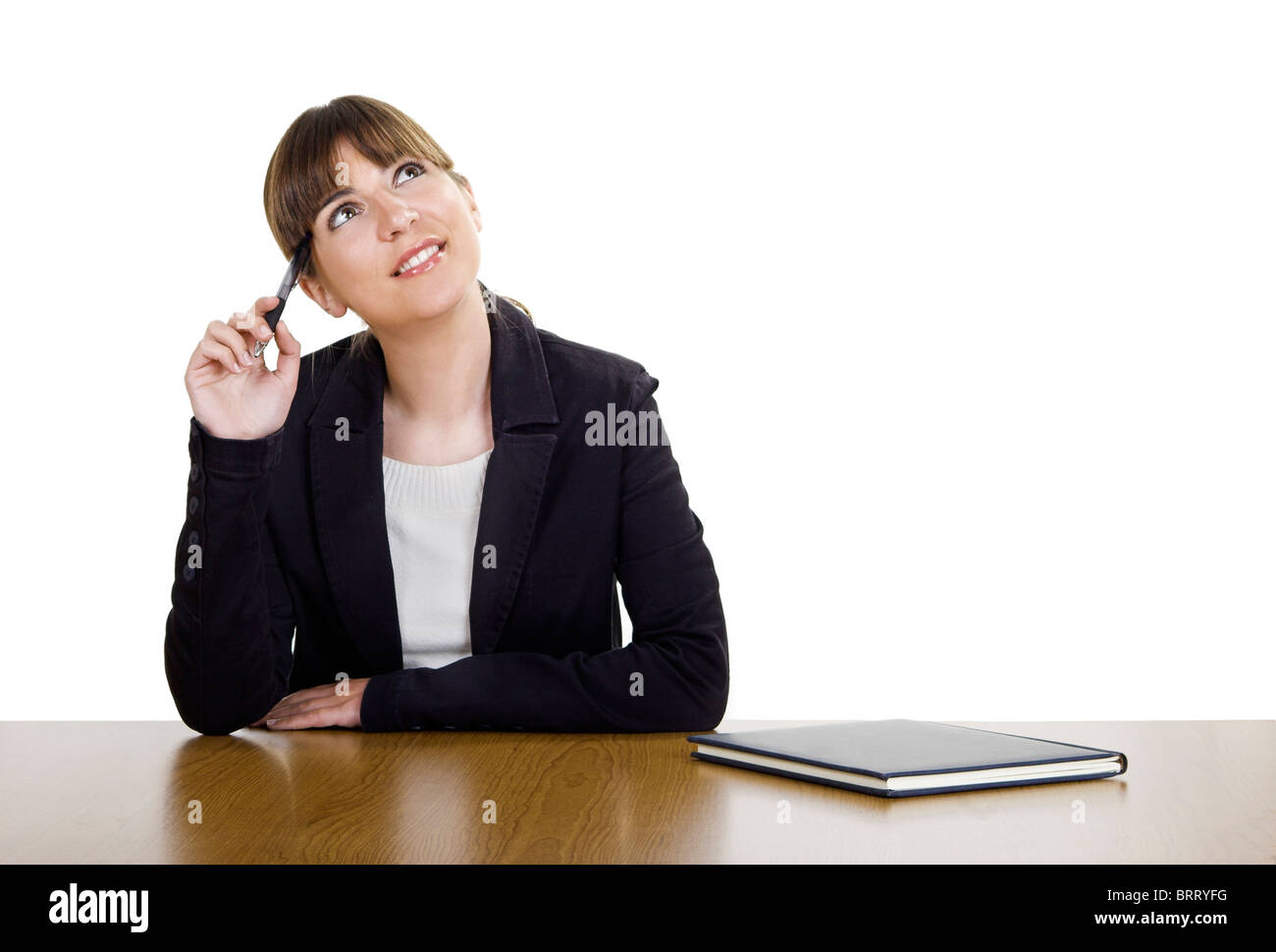 Beautiful business woman at office working - isolated on white ...