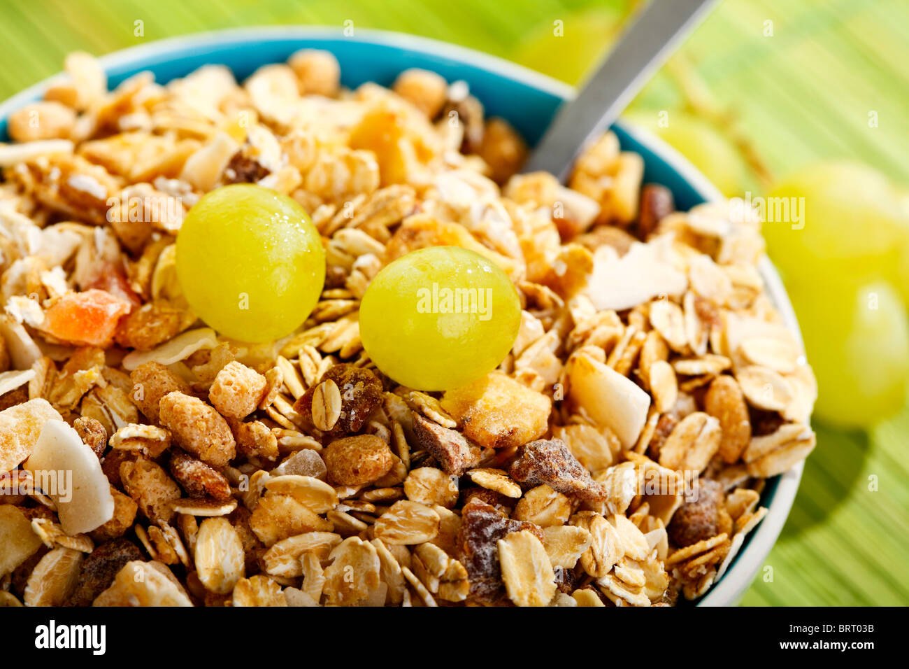 Fruit musli and grapes in a bowl Stock Photo - Alamy