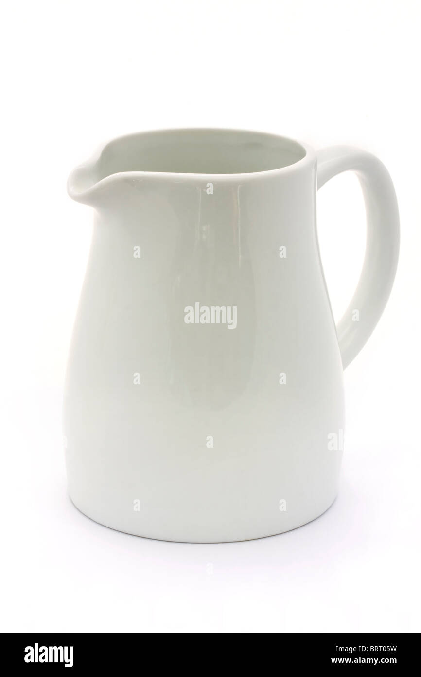 white ceramic jug on a white background Stock Photo - Alamy