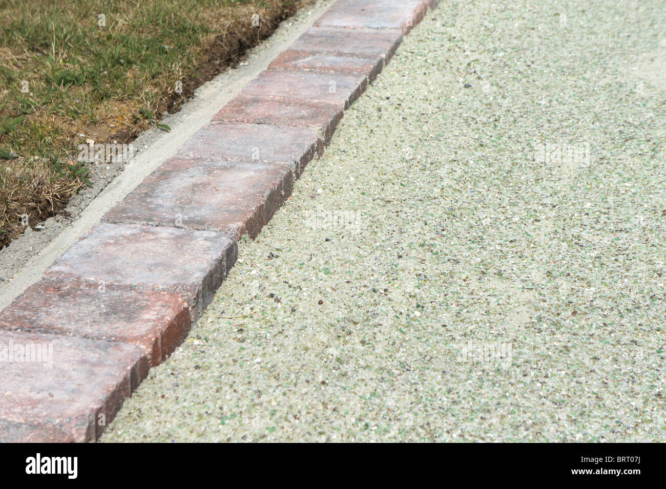 New house driveway construction. Close-up image shows the surface has ...
