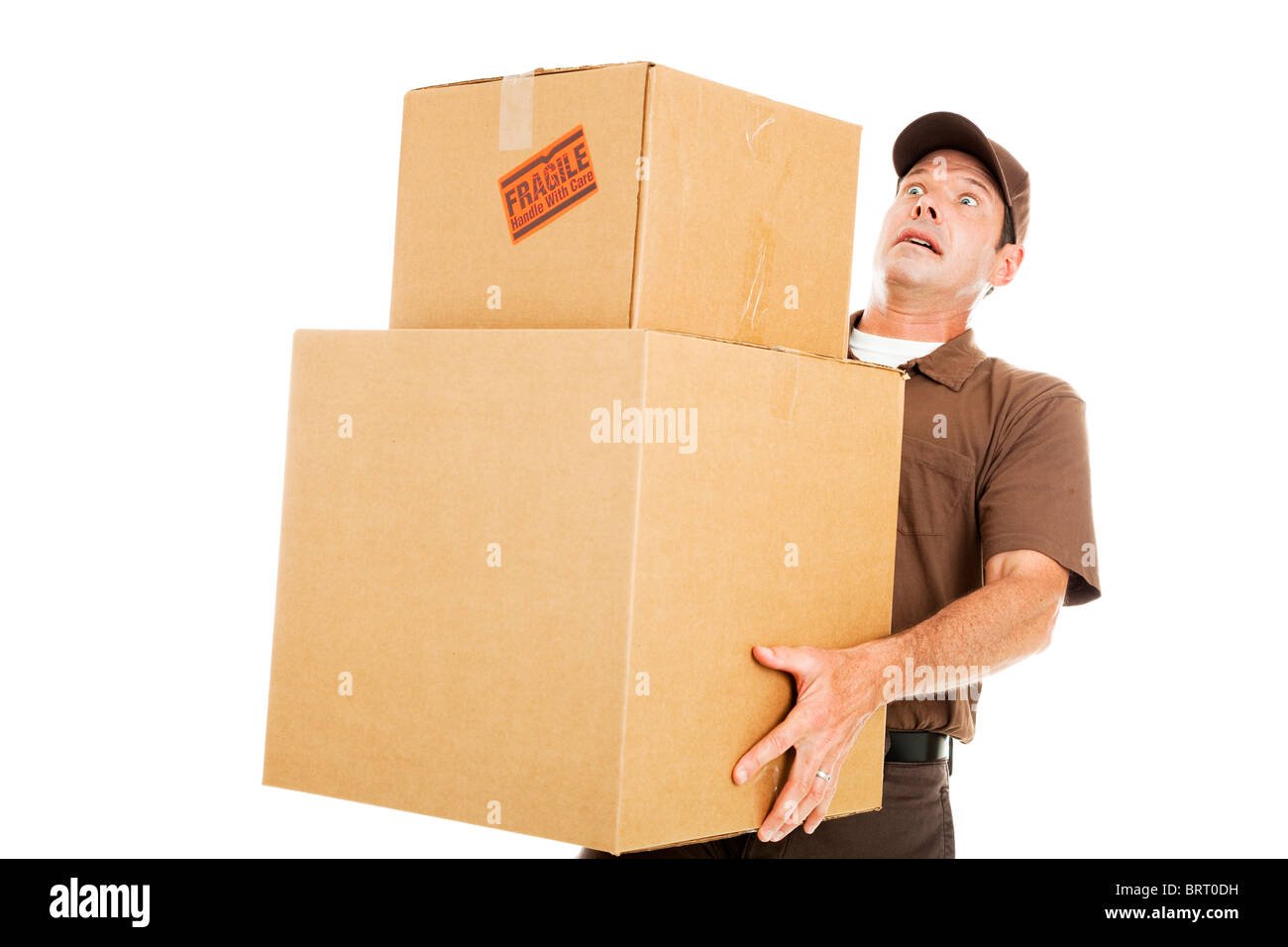 Delivery man or mover about to drop a stack of large boxes. Isolated on ...