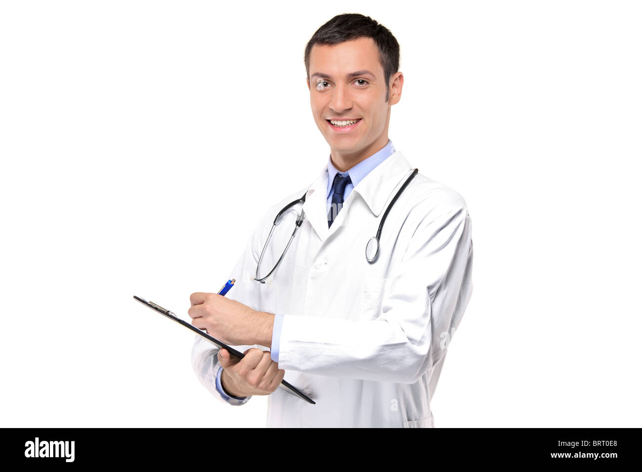 A portrait of a smiling medical doctor writing down notes in a notebook ...